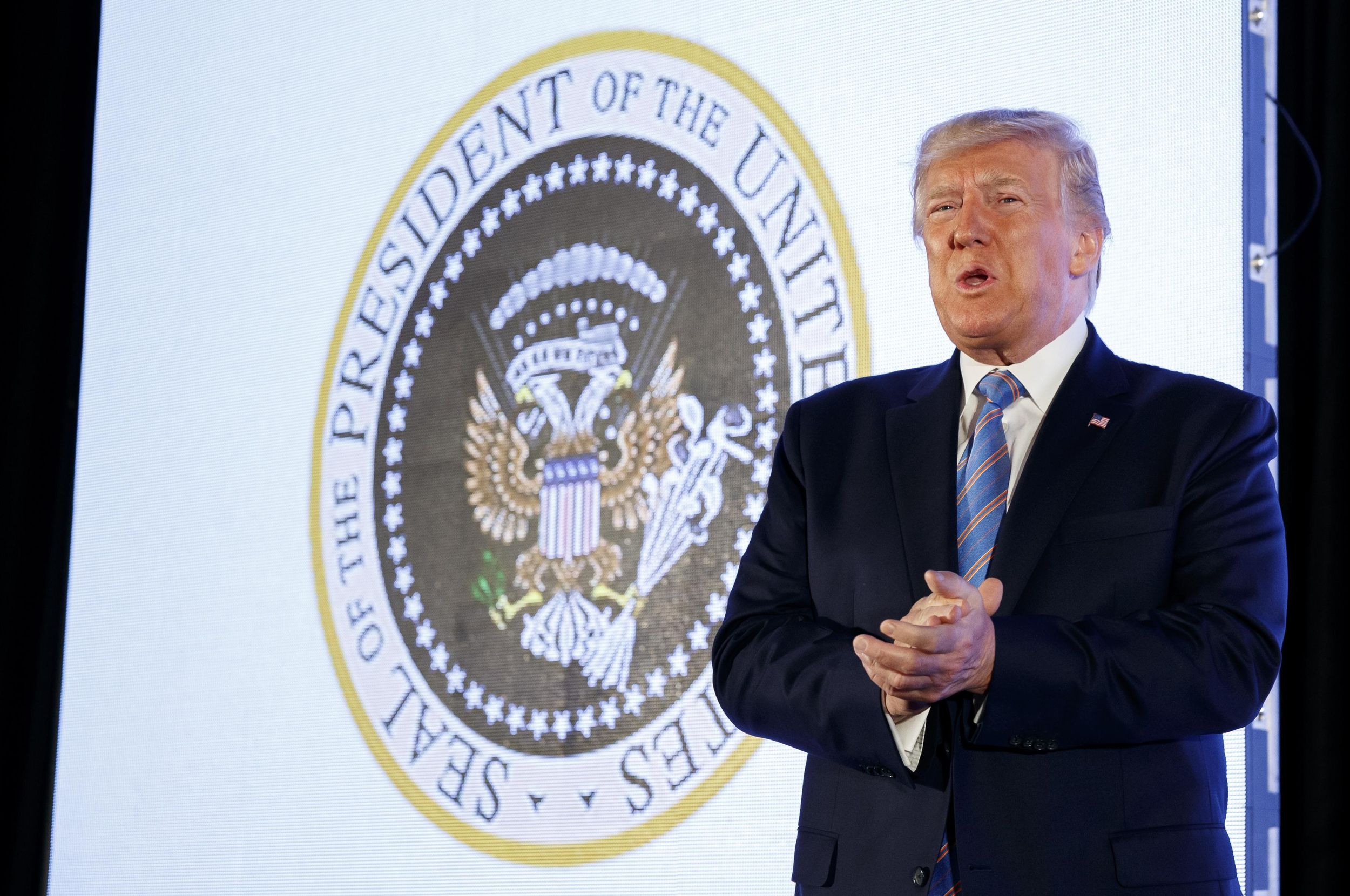 Eagle with golf clubs? Altered seal at Trump speech