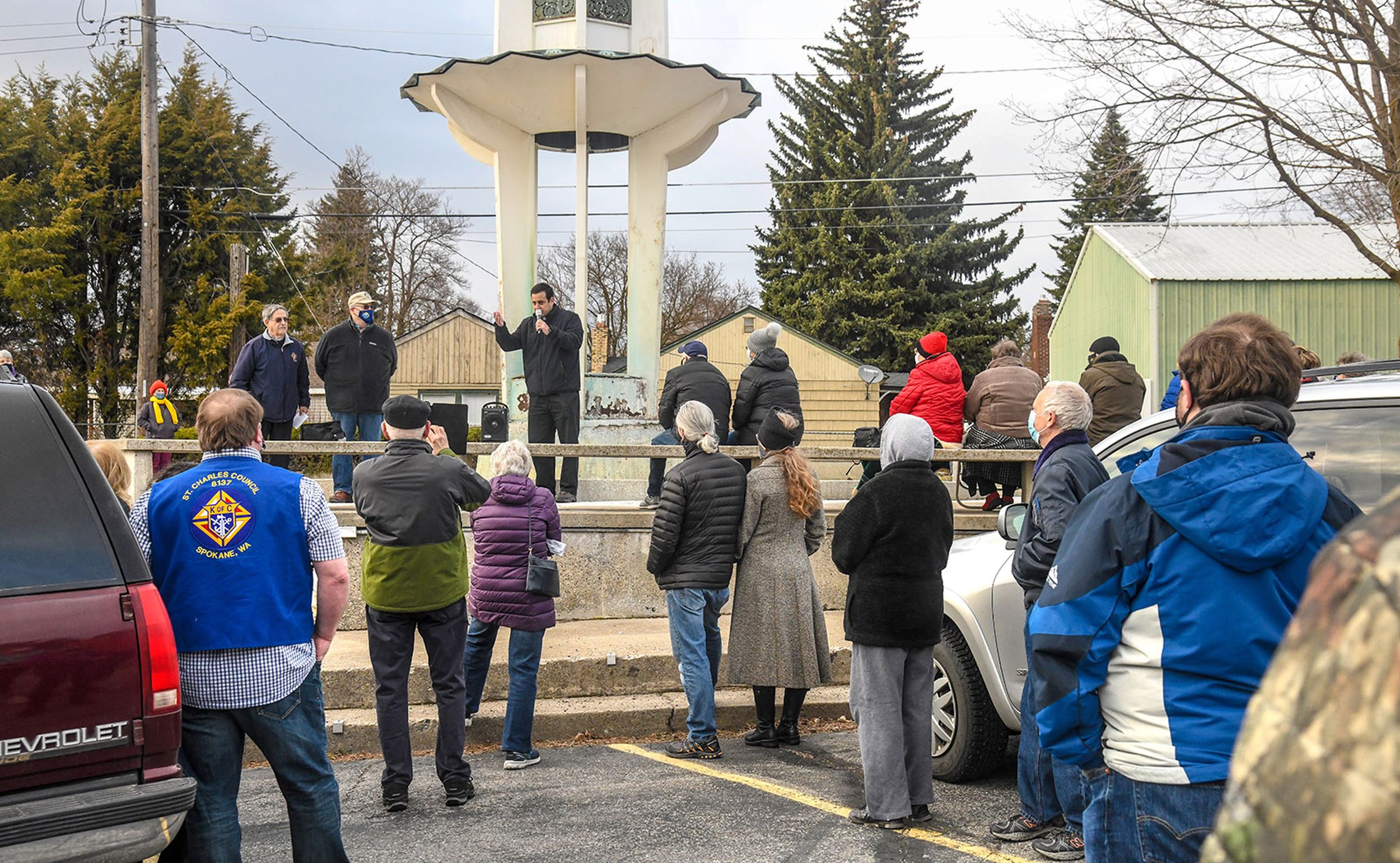 Deacon Roy Buck led the socially distanced group in their quiet Hail ...