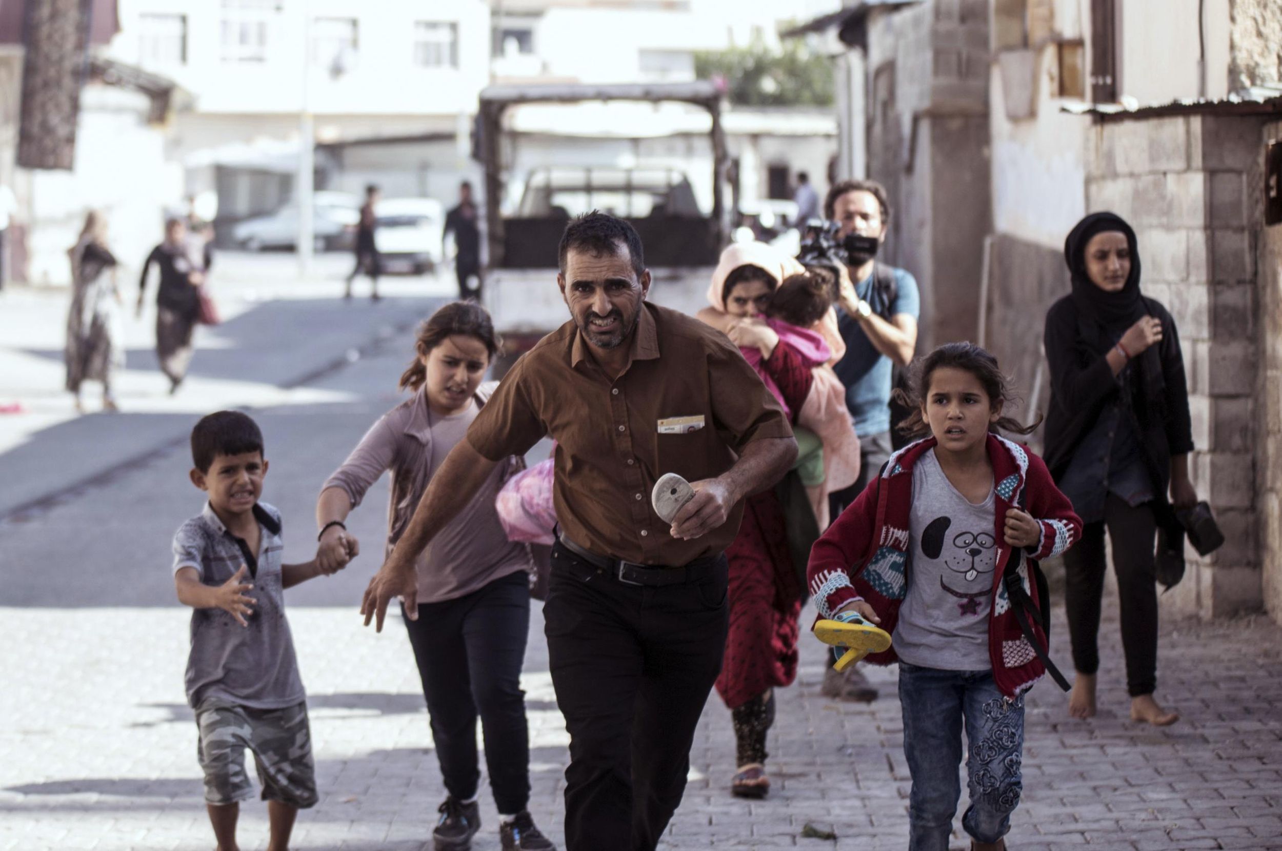 Turkey presses Syrian assault as thousands flee the fighting