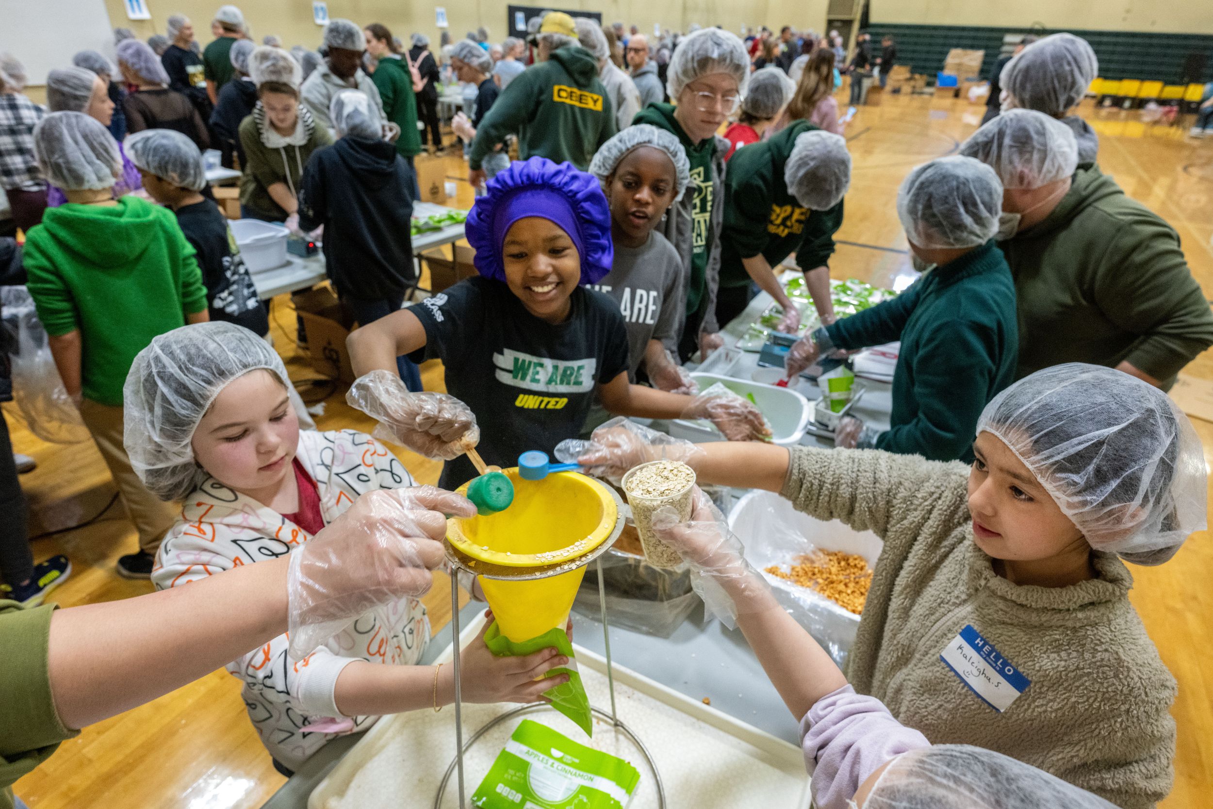 Shadle Park High School joins forces with younger students to stuff ...